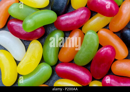 Abstract jelly sugar red candy over pink background Stock Photo - Alamy