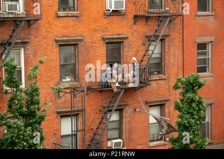 Tenement with fire escapes in Brooklyn as seen through the scratched ...