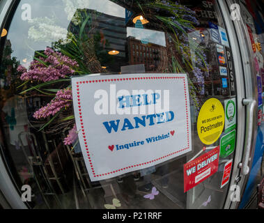 A help wanted sign in a storefront, Tuesday, Nov. 1, 2022, in Bedford ...