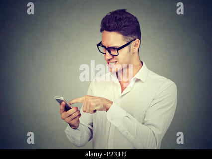 angry man sending text message on his mobile phone isolated on white ...