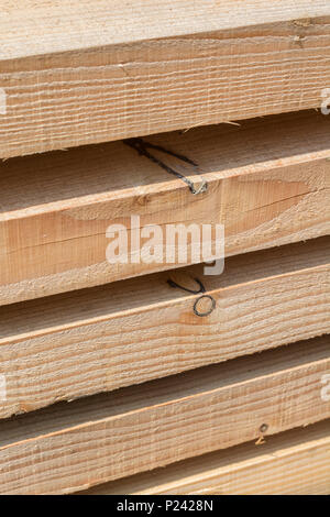 Neatly stacked wooden planks for construction or artistic projects ...