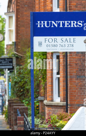 Hunters estate agent, for sale sign property market Stock Photo - Alamy