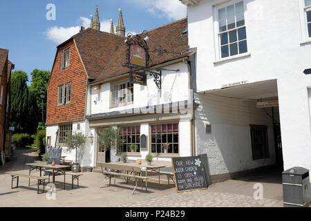 The Woolpack hotel 15th century pub exterior with tables outside in ...