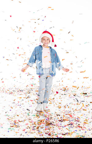 Happy child in santa hat near christmas tree at home Stock Photo - Alamy