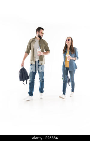 smiling boyfriend and girlfriend with milkshakes, isolated on white ...