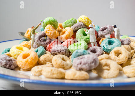 Tiny painting crew paints the oat loop cereal rainbow of colors Stock ...
