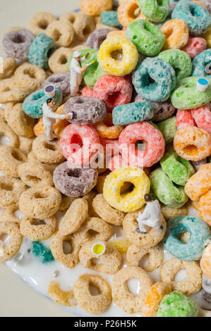 Tiny painting crew paints the oat loop cereal rainbow of colors Stock ...