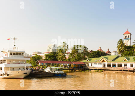 A ship and the Myanmar Port Authority building by the Yangon river in ...