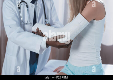 Woman at work with plaster cast on leg Stock Photo: 24588237 - Alamy