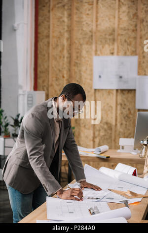 Young handsome african american architect man smiling happy. Standing ...