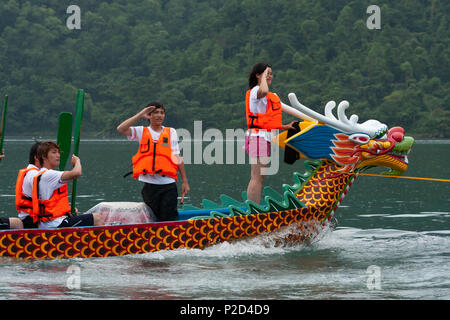 Dragon Boat Festival, flag catcher takes the flag during the dragon ...