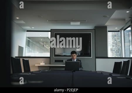 Business man using laptop in black suit with panoramic city view ...