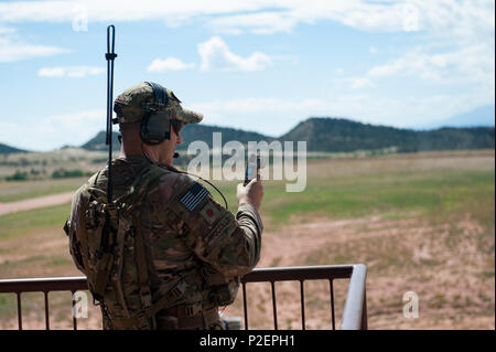 Maj. John Fuccillo, an air mobility liaison officer, looks on as a C ...