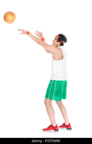 Side view of skinny basketball player with ball in hands isolated on ...