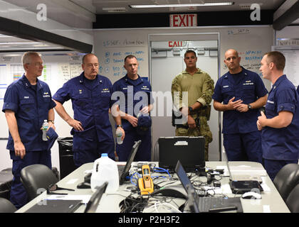 Coast Guard Adm. Steve Poulin and Cmdr. Tim Brown, commanding officer ...