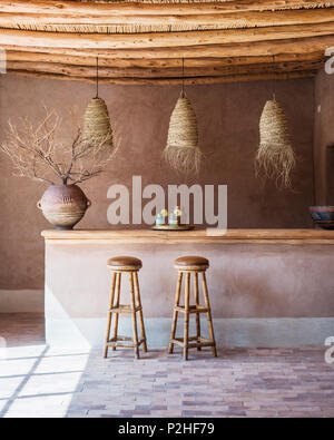 three antique lamps hang in narrow lane in the old town of Bolzano ...