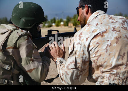 A NBC defense soldier in protective gear, pictured decontaminating a ...