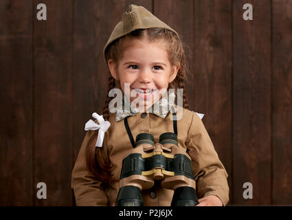 child girl are dressed as soldier in retro military uniforms Stock ...