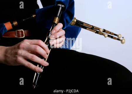 Young woman playing the Northumbrian Pipes Stock Photo - Alamy