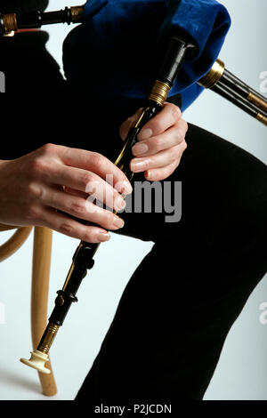 Young woman playing the Northumbrian Pipes Stock Photo - Alamy
