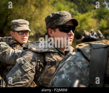 6th Ranger Training Battalion Soldiers and civilian guests stand for ...