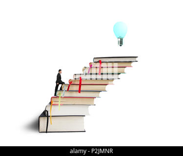 Businessman student climbing the ladder of education books Stock Photo ...
