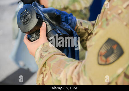 A U.S. Soldier with 650th Military Intelligence Group cleans his M50 ...