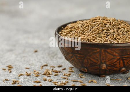 Cumin seeds (Zira) in a ceramic bowl close-up. Seasoning. Condiment ...