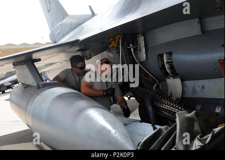 The 309th Aircraft Maintenance Unit weapons load crew members, prepare ...