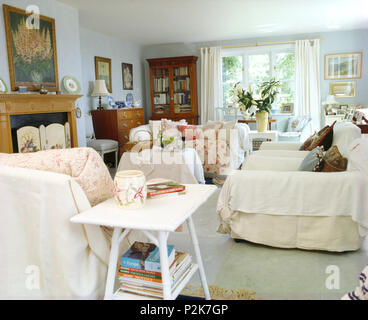 living room with sofas, tables and a small cabinet or shelf Stock Photo ...