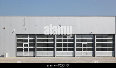 Five Big Doors at New Garage Service Building Stock Photo - Alamy