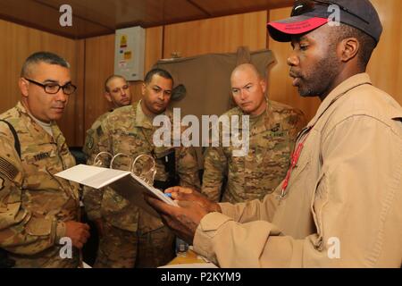 Sgt. Jose Irizarry, left, and Maj. William Rozar, both working as ...