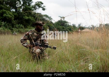 A Cameroon army soldier pulls security during a patrol as part of a ...