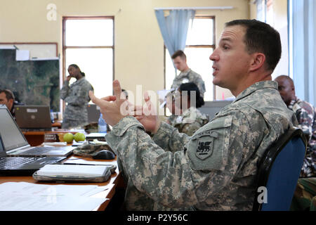 Capt. Scott Saunders, U.S. Army Africa, receives an intelligence brief ...
