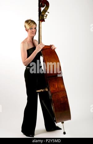 Generic - Female Double Bass player, playing 'Ponticello' Model release ...