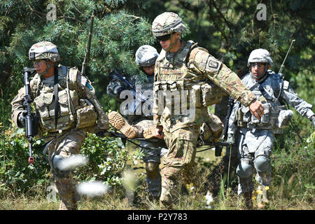 A U.S. Soldier with the 650th Military Intelligence Group acts as ...