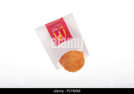 McDonald’s Hash Brown potato patty in wrapper isolated on white ...