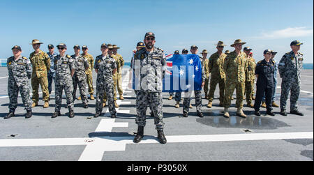 The Australian Leander class light cruiser HMAS Sydney coming alongside ...