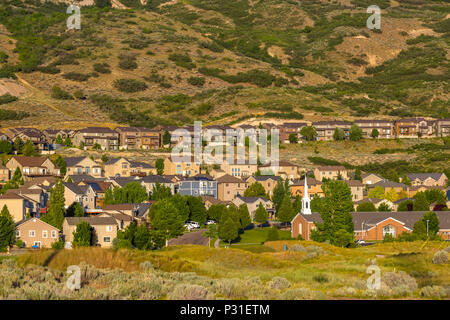 Highland houses at sunset with hills in background Stock Photo - Alamy