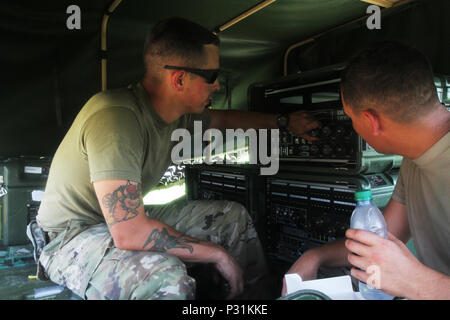 Spc. Brandon McClure (left), a Command Post Node operator and Sgt ...