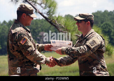 Maj. Mark Moretti (left), brigade operations officer in charge with 2nd ...