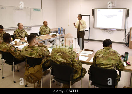 Mr. Georg Cater, standing, Chief of Command Training Branch, Combined ...