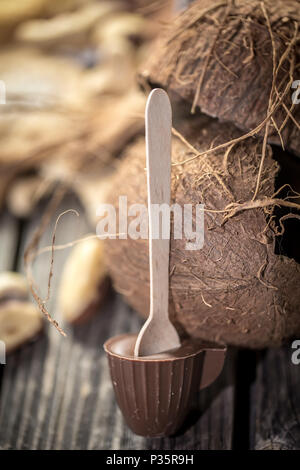 Chocolate truffles in small wooden dish sprinkled with cocoa powder ...