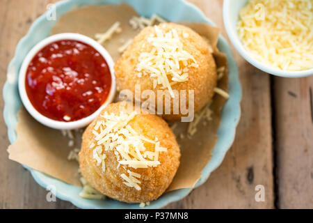 Cheddar cheese bombs with pasta filling & chilli jam Stock Photo - Alamy