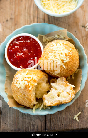 Cheddar cheese bombs with pasta filling & chilli jam Stock Photo - Alamy