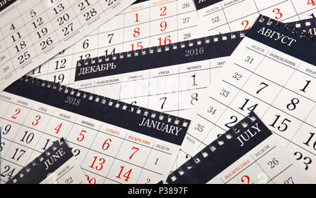 pile of wall calendar sheets on the table Stock Photo - Alamy
