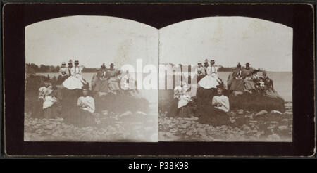 Group of men and women at the beach, by James G Lock Stock Photo - Alamy