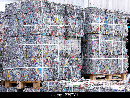 Pressed cubes of cans for recycling at the waste segregation station in ...