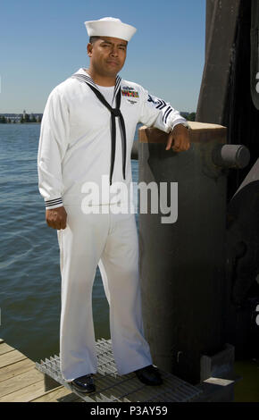 WASHINGTON (Sept. 19, 2007) - A Sailor shows off the prototype uniform ...