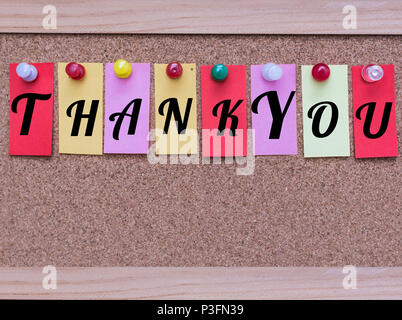 Colored Sticky Notes with White Words Thank You Pinned to a Cork ...